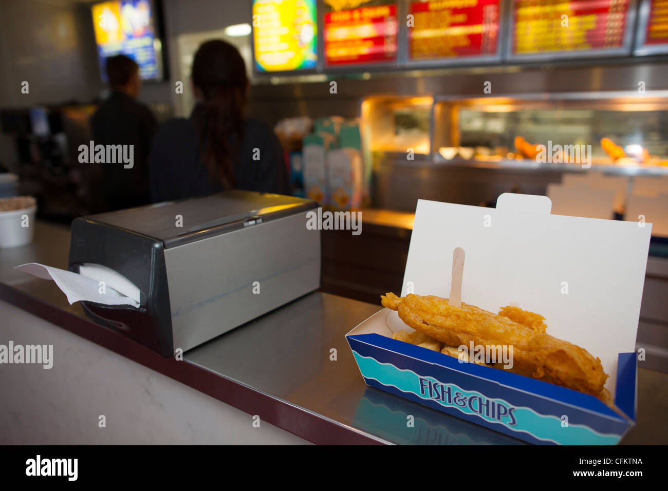 Good old fashioned fish and chips being served in a chippy in Ullapool ...