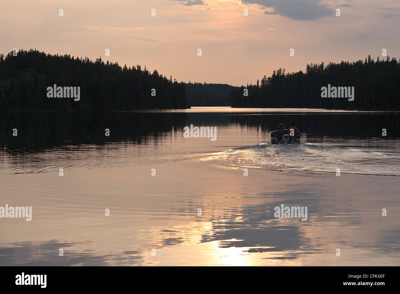 Boat leaving the dock to go fishing Stock Photo - Alamy