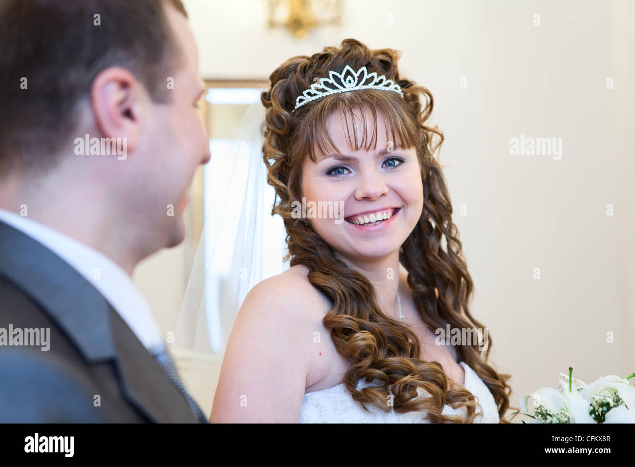 Young wedding Caucasian Russian couple. Bride close up in front of ...