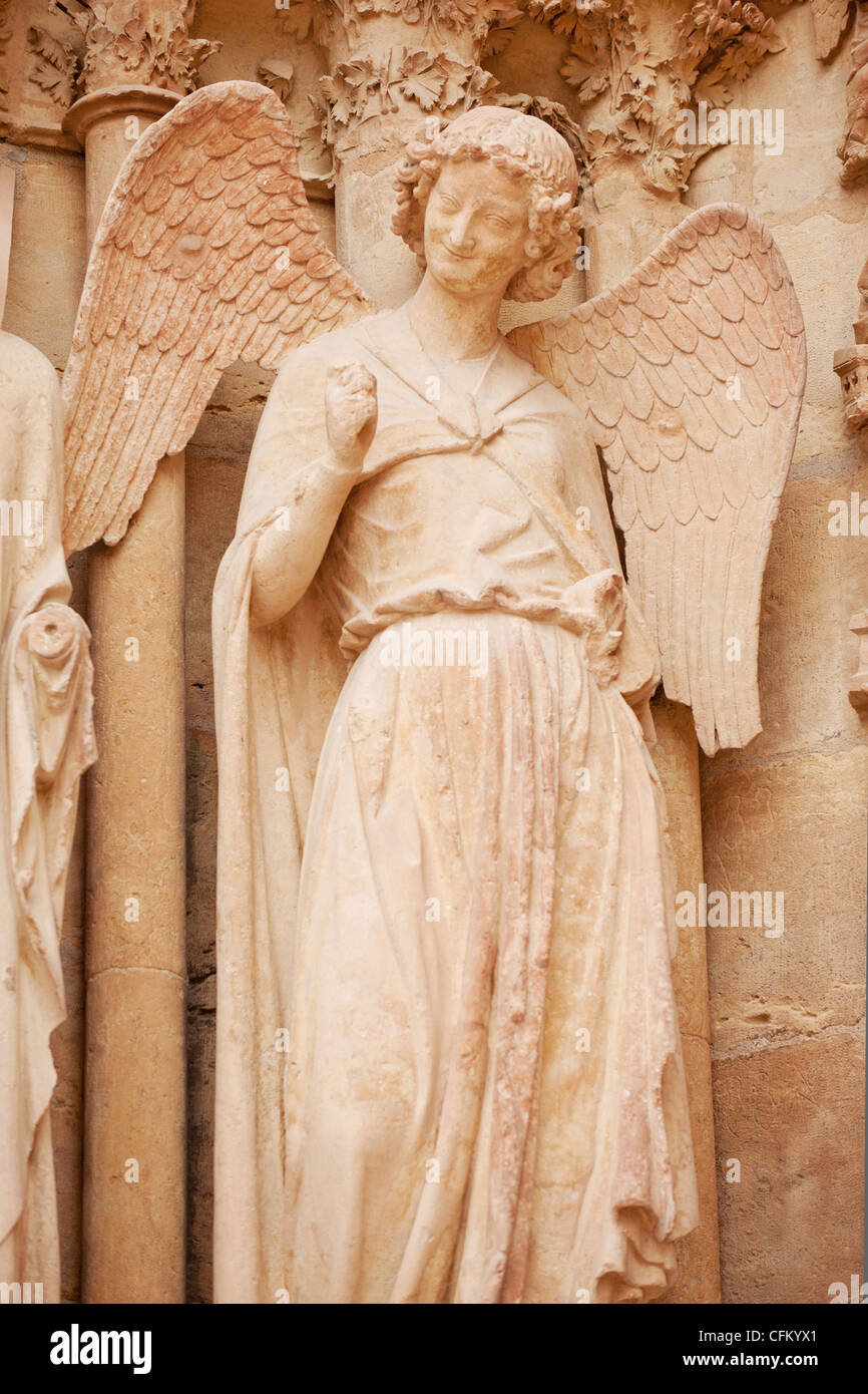 Famous smiling angel on facade of Reims Cathedral, Champagne, France ...