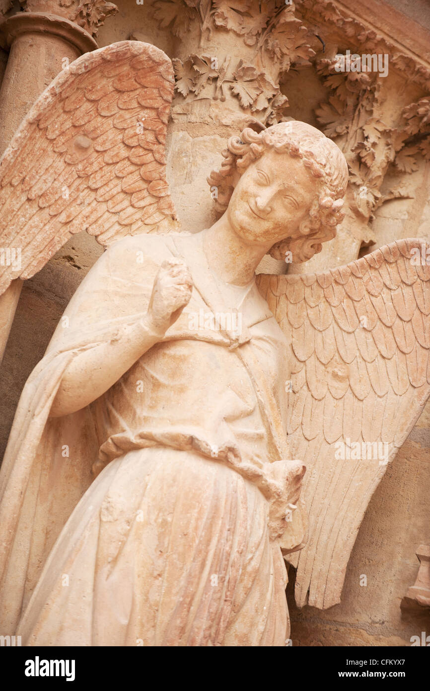 Famous smiling angel on facade of Reims Cathedral, Champagne, France ...