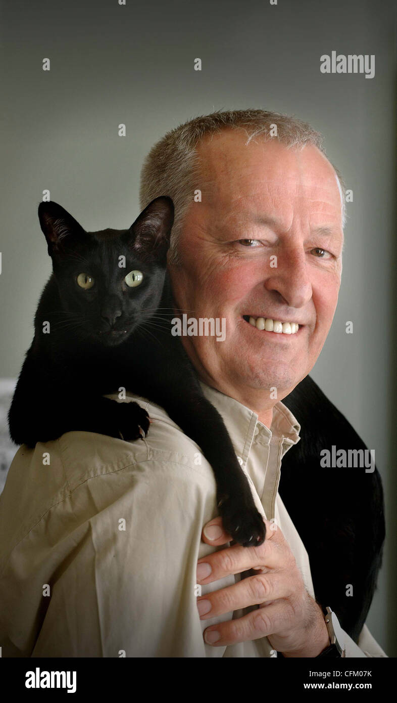 Photographer Roger Bamber and his cat Noggin Stock Photo - Alamy