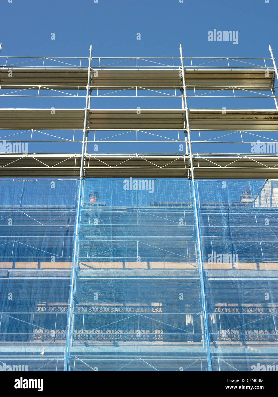 Scaffolding on a building by beautiful blue day Stock Photo - Alamy