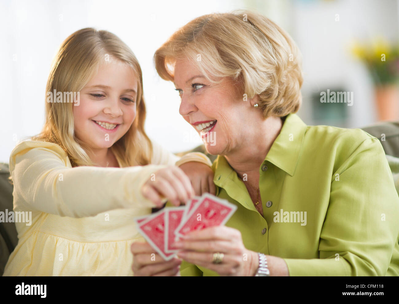 Two girls playing cards hi-res stock photography and images - Alamy