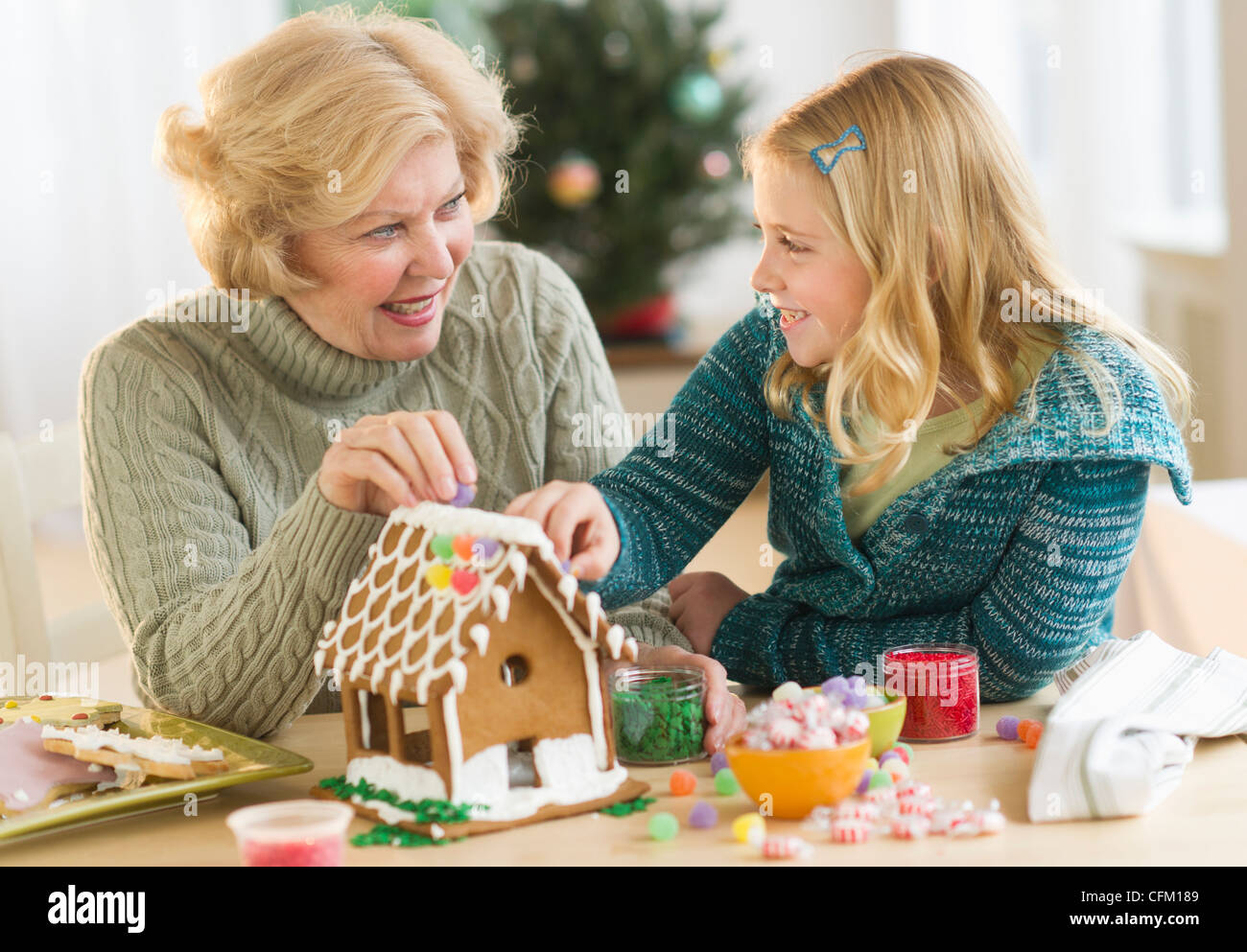 Children making gingerbread house hi-res stock photography and images ...