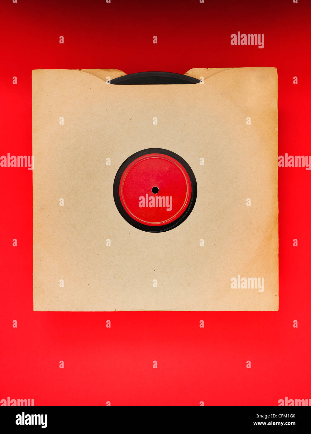 Vinyl record in envelope on red background, studio shot Stock Photo - Alamy