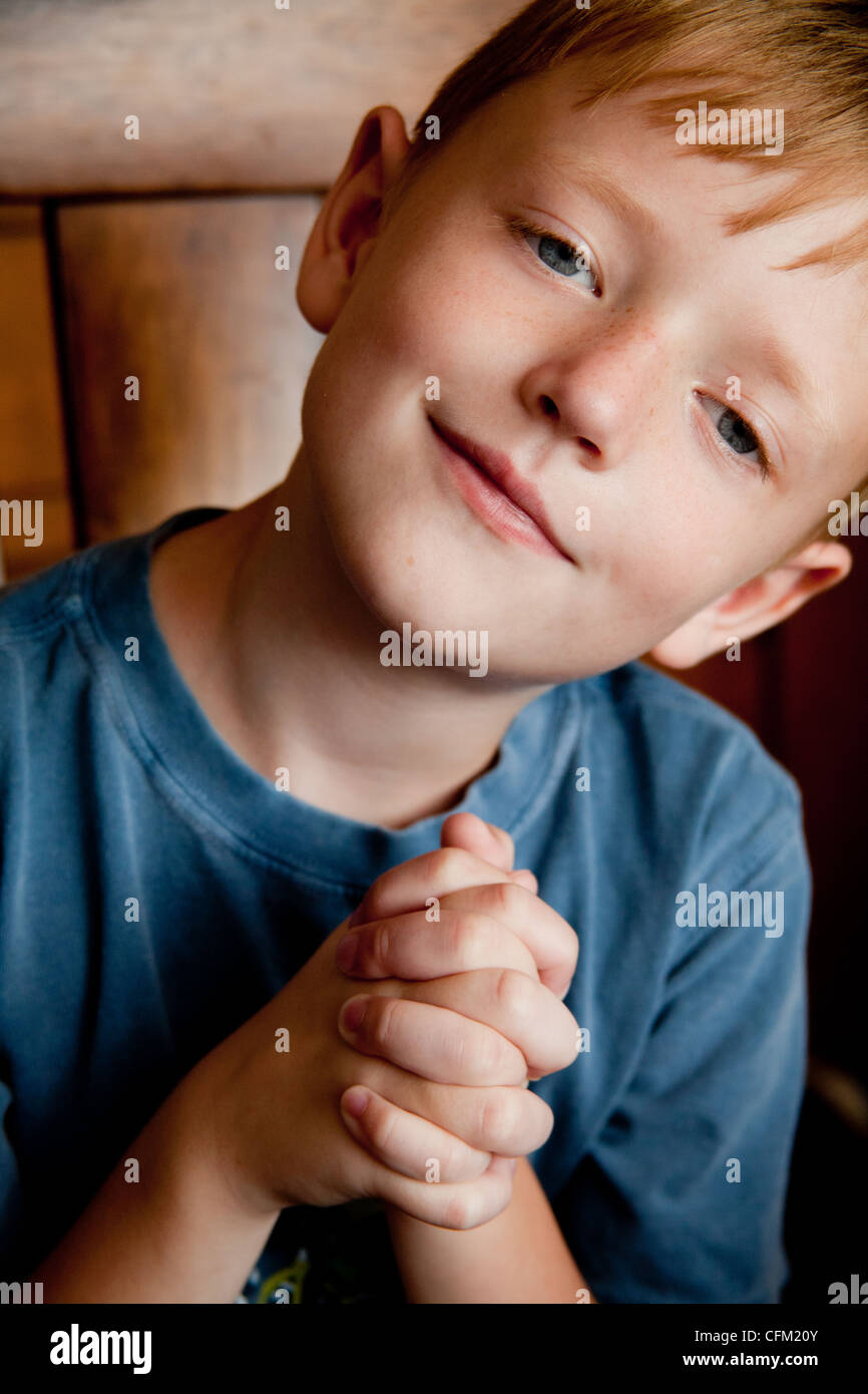 clean cut 9 yr old white boy begging or praying to get what he wants ...