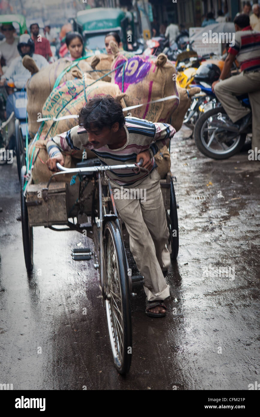 Indian man on a bike Stock Photo - Alamy