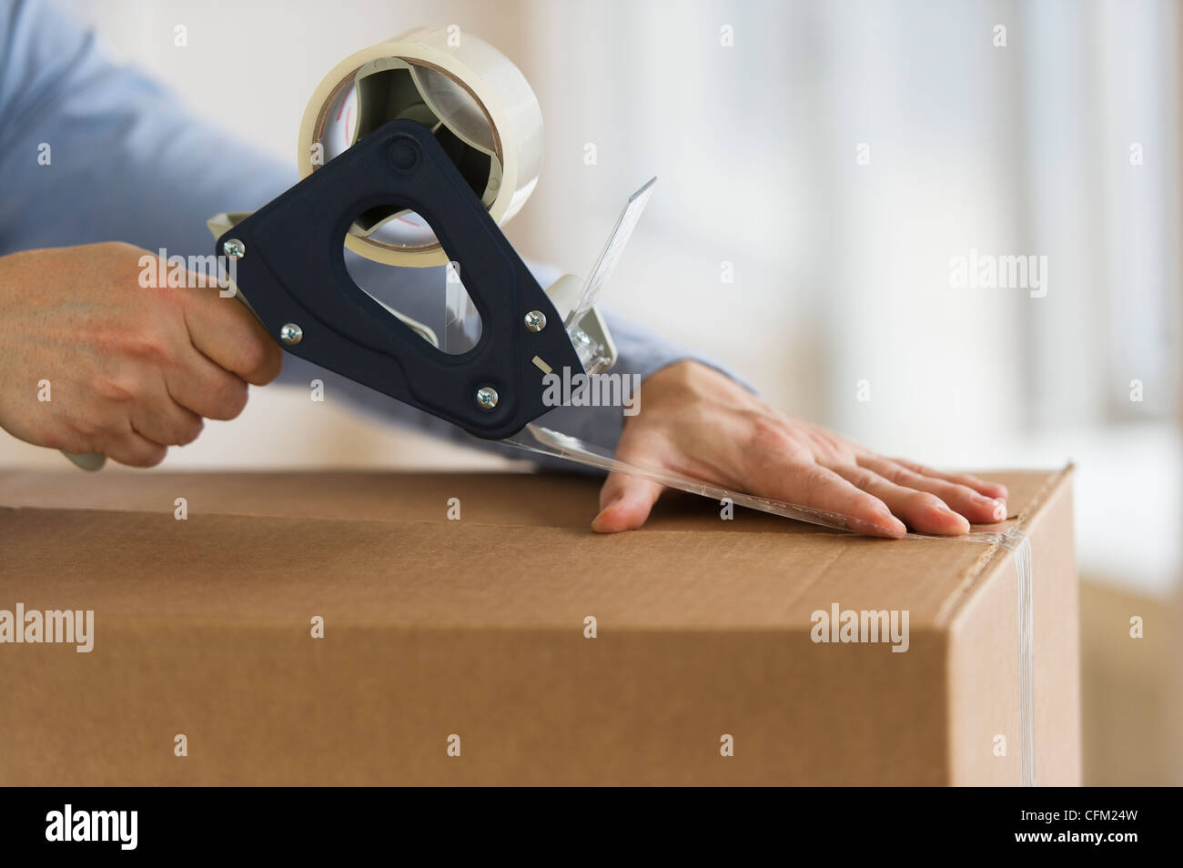 Jersey City, New Jersey, Man's hands packing delivery Stock Photo - Alamy