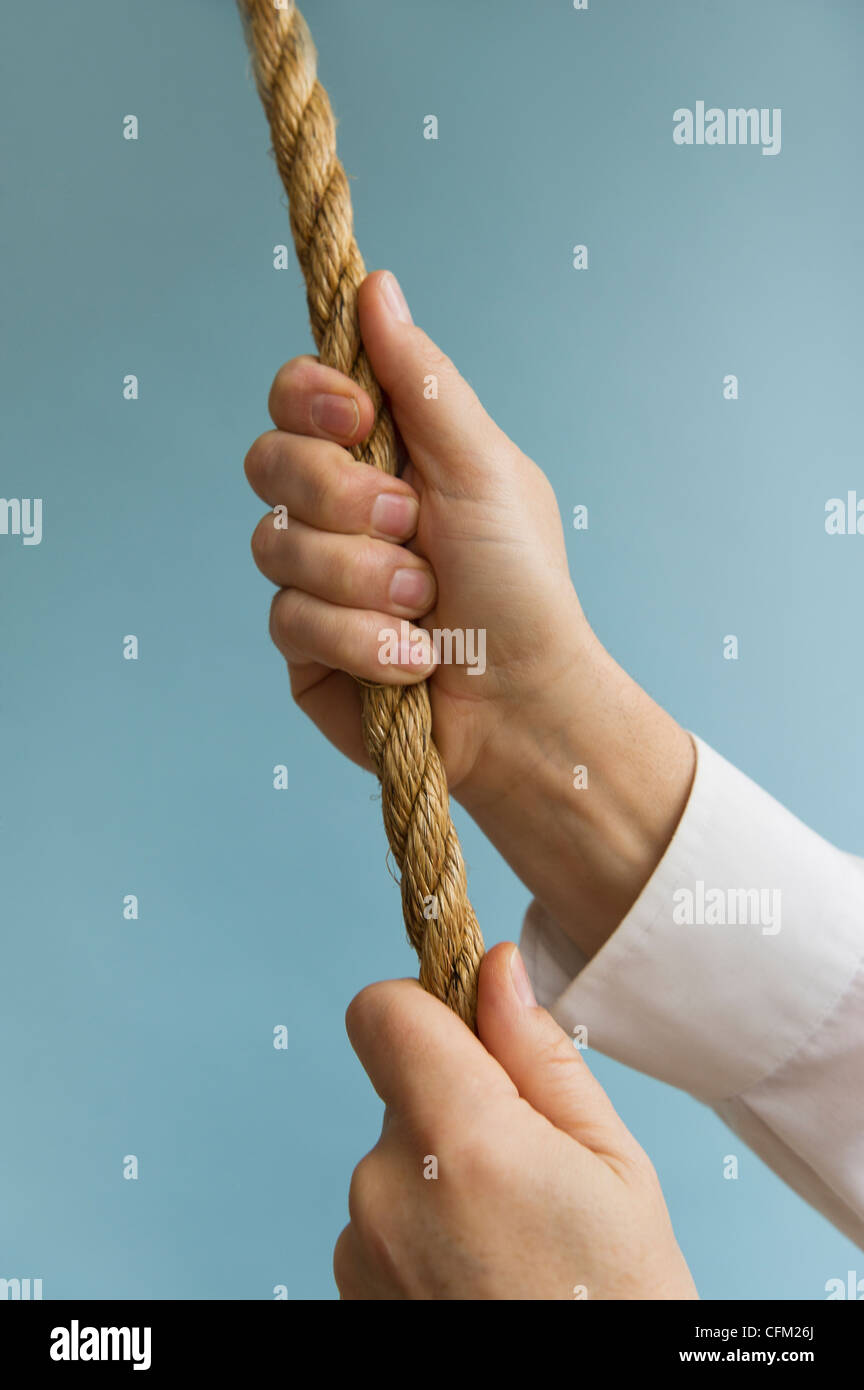 Male hand pulling rope hi-res stock photography and images - Alamy
