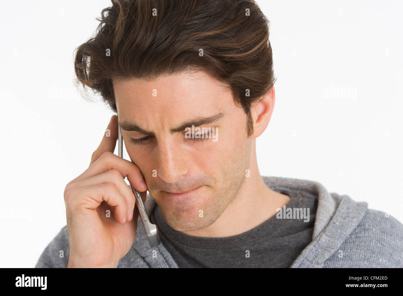 Man biting lip phone hi-res stock photography and images - Alamy