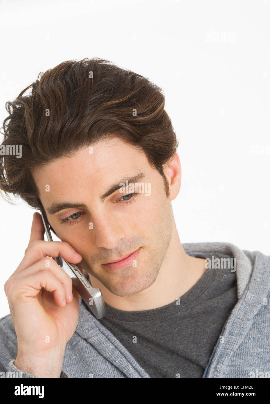 Man biting lip phone hi-res stock photography and images - Alamy