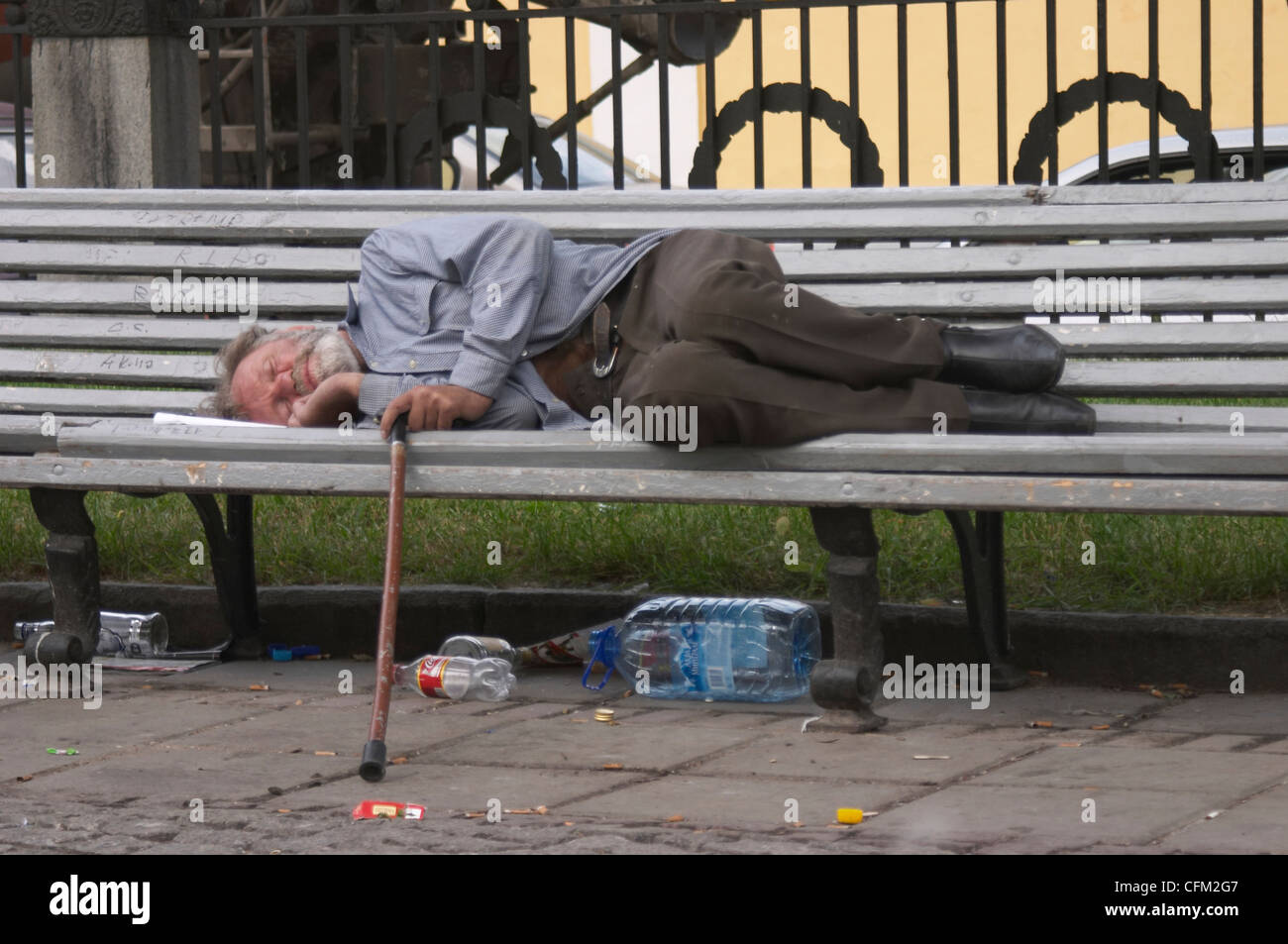 homeless old man sleeping on the bench in the street of Moscow Russia ...