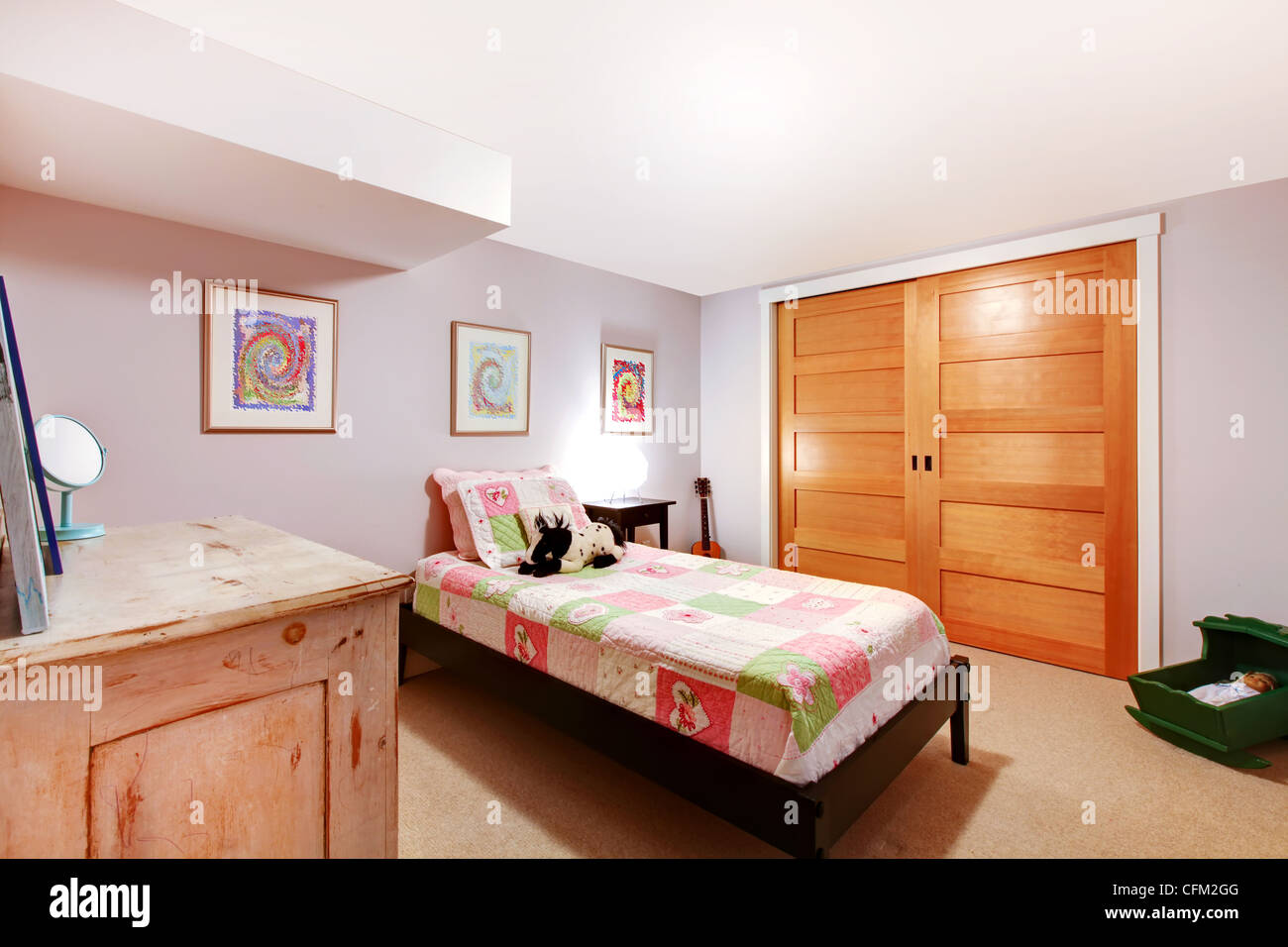 PInk girl kids bedroom in the basement with closet doors and dresser ...