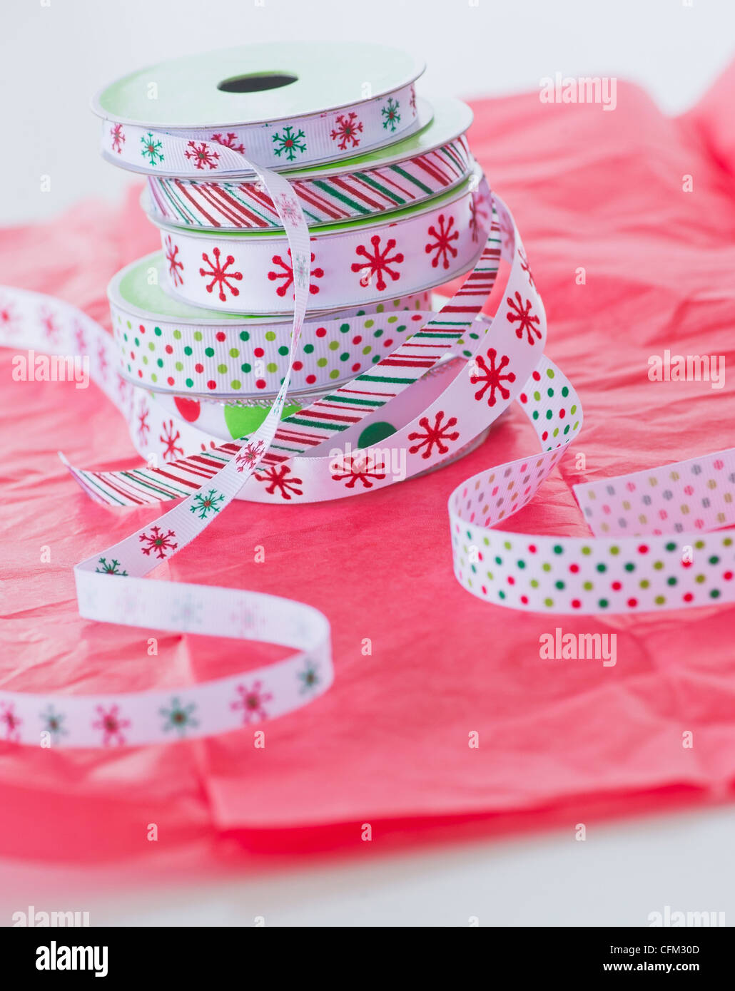 Stack of colorful ribbons on wrapping paper Stock Photo - Alamy