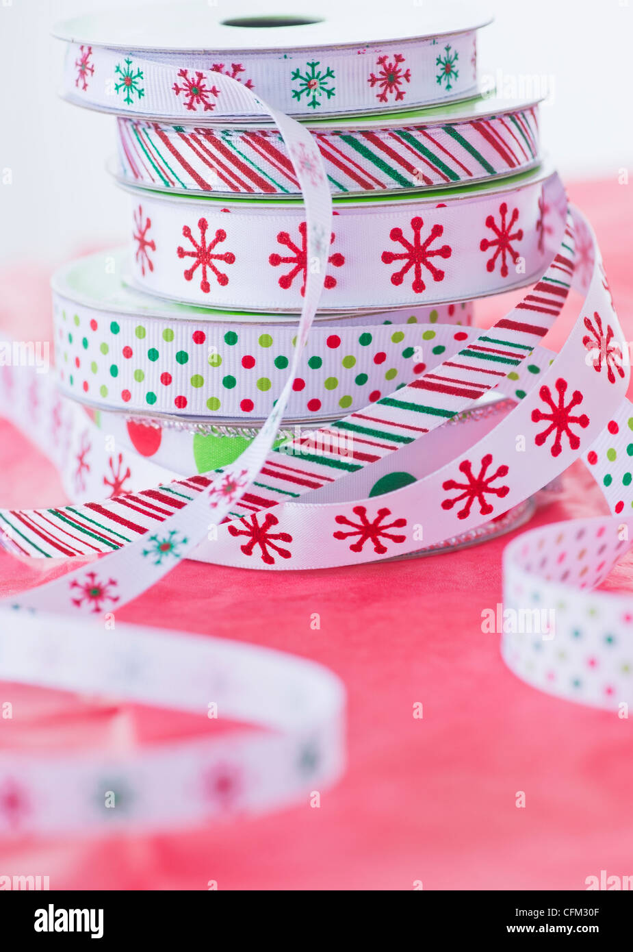 Stack of colorful ribbons on wrapping paper Stock Photo - Alamy
