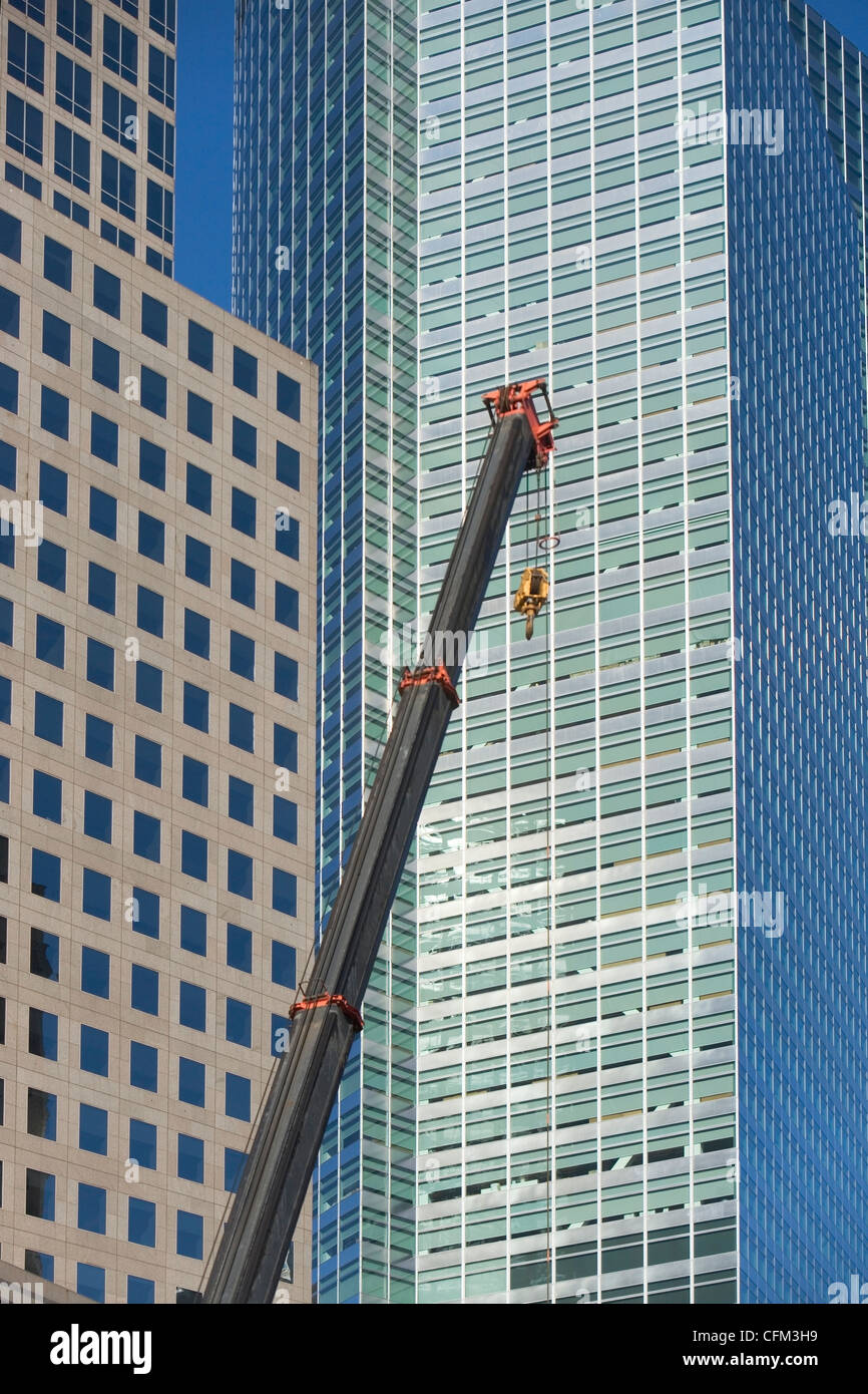 Usa, New York State, New York City, crane's hook in front of skyscraper ...