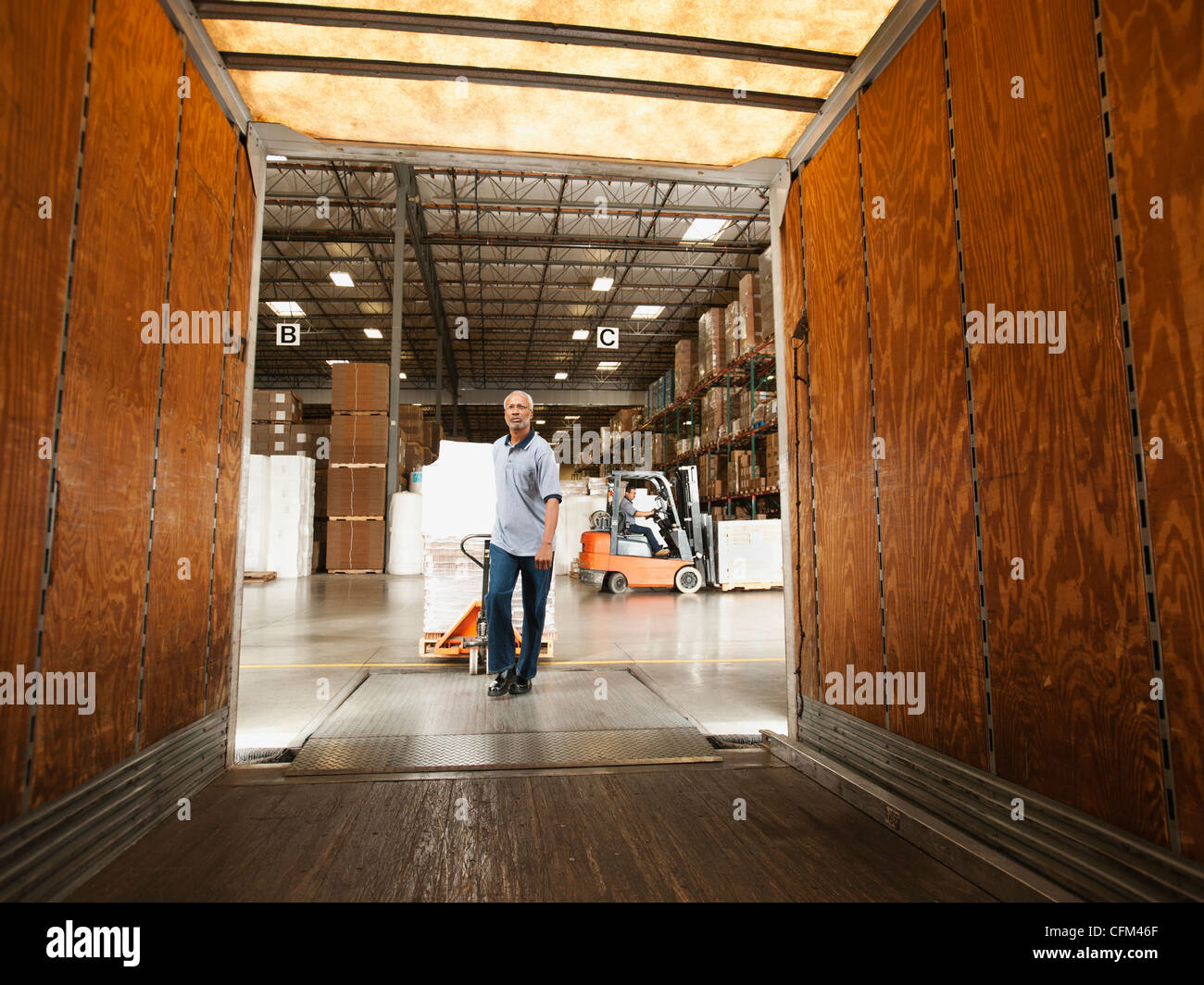 Man pulling hand cart in hi-res stock photography and images - Alamy