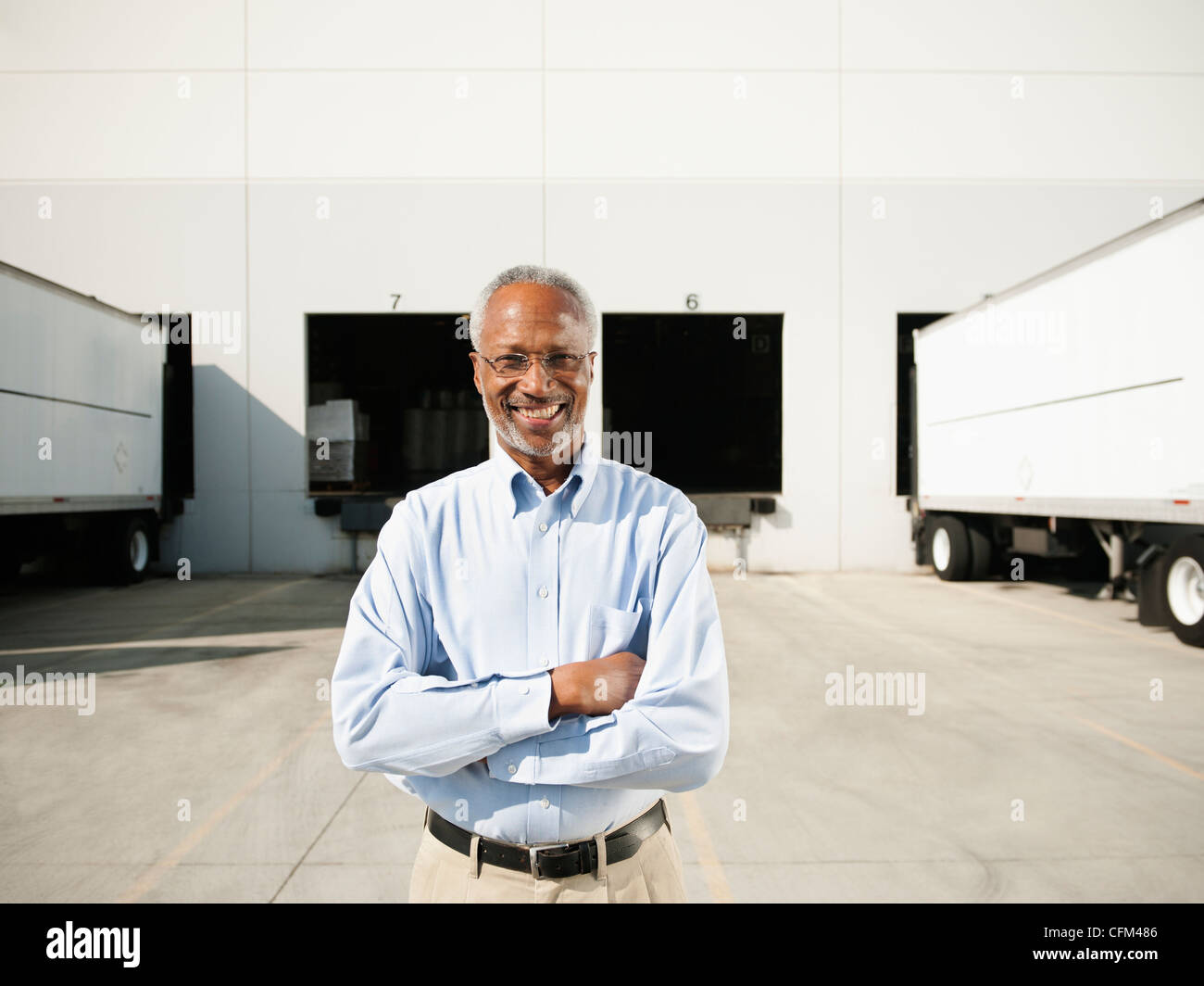 USA, California, Santa Ana, Portrait of businessman outside warehouse ...