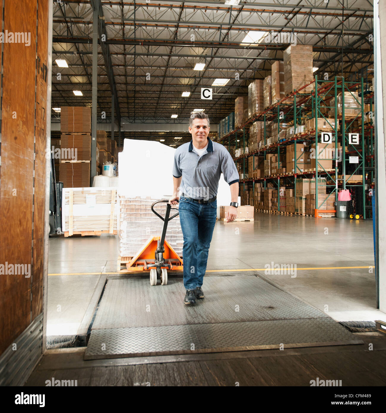 USA, California, Santa Ana, Man working in warehouse Stock Photo - Alamy