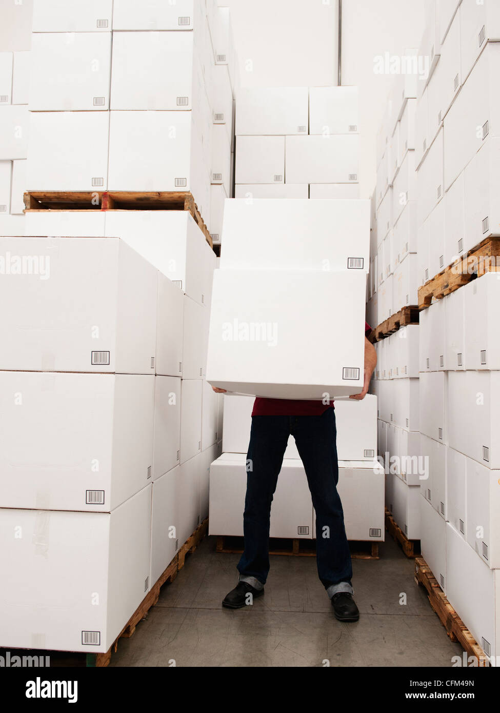 Delivery man carrying large box hi-res stock photography and images - Alamy