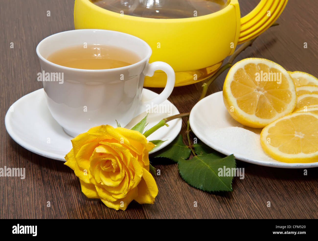 Tea with lemon and yellow rose Stock Photo - Alamy