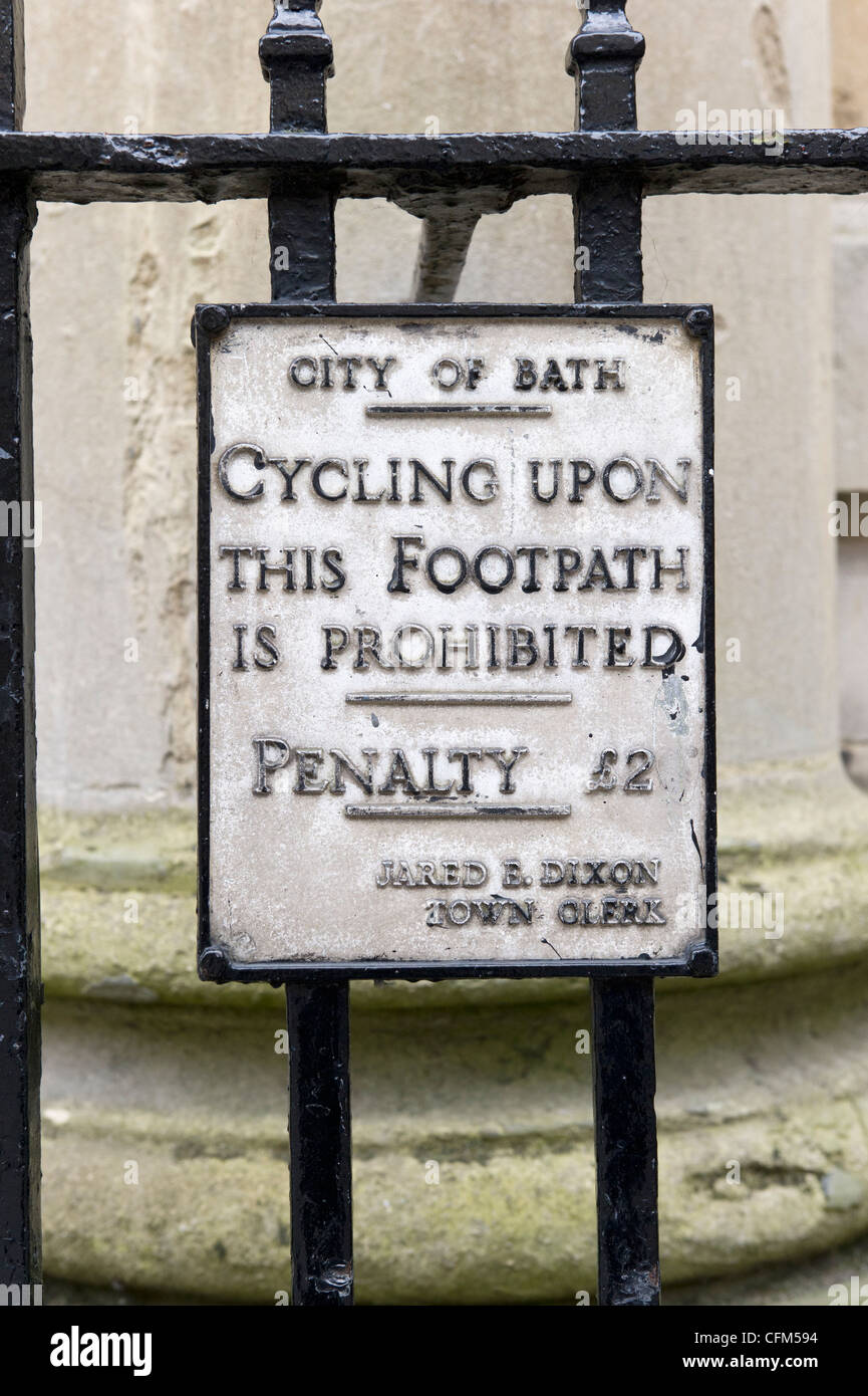 Old fashioned traditional street sign: cycling on the footpath ...