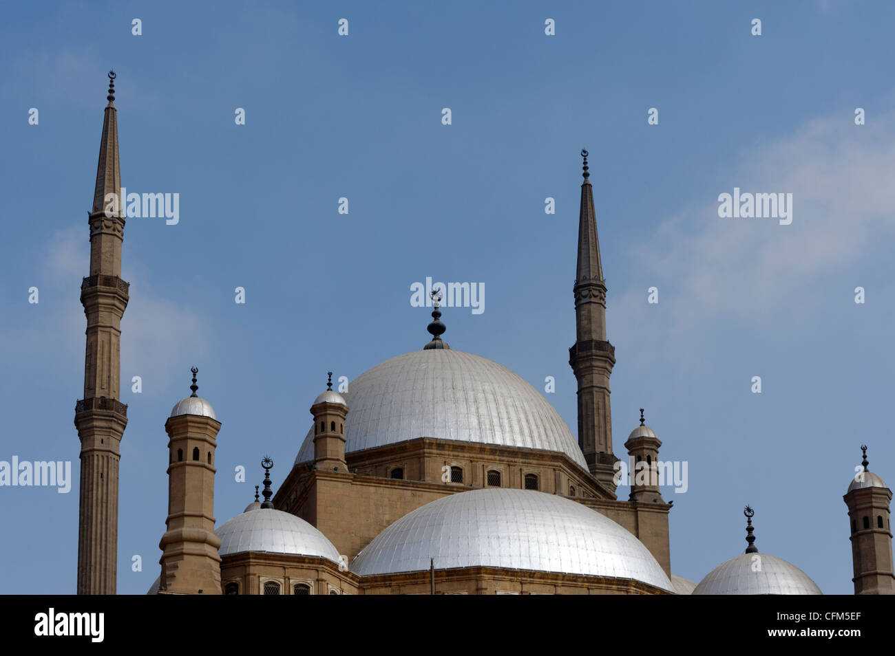 Cairo. Egypt. View of two towering minarets and multiple half-domes ...