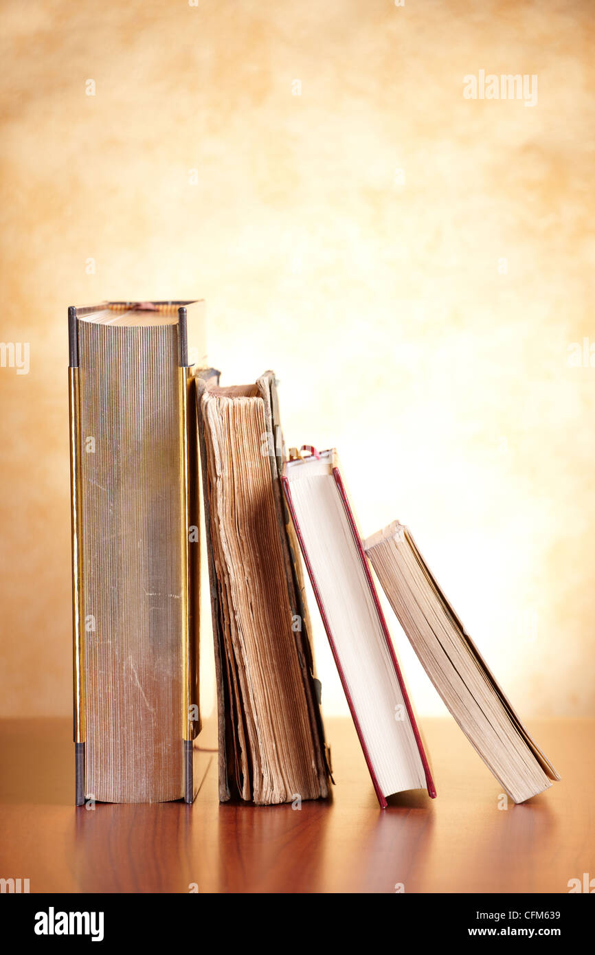 Old books on the wooden table Stock Photo - Alamy