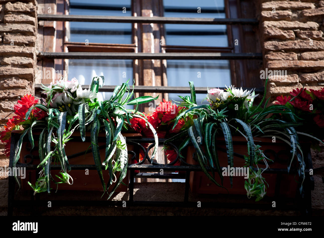 Spring flowers out of a window Stock Photo - Alamy