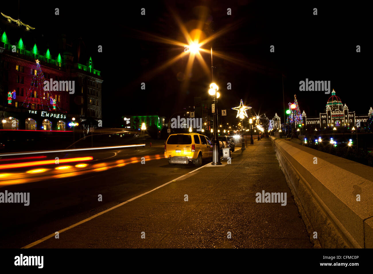 A night scene of Victoria's inner harbor at Christmas time, including ...