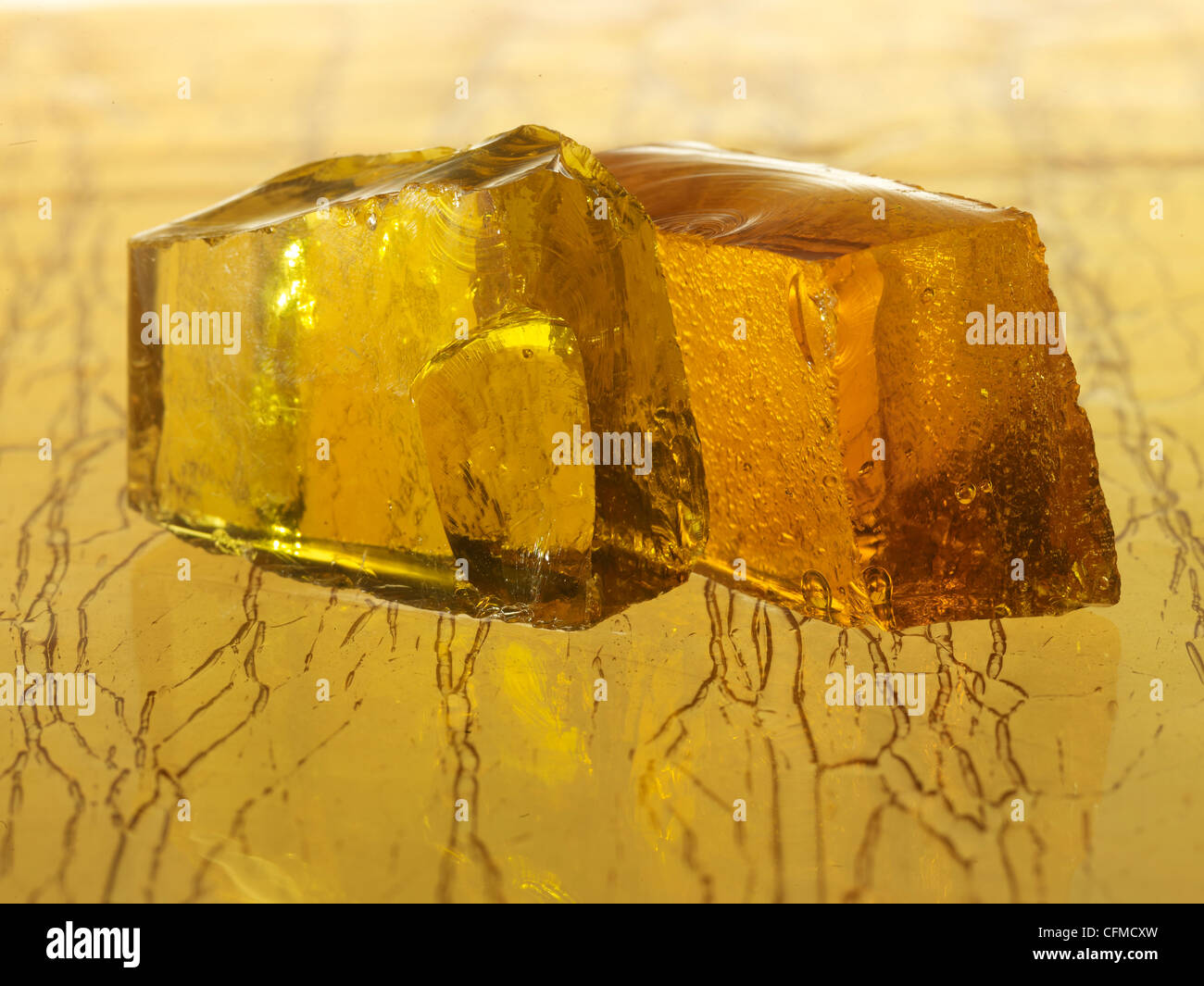 Still life of yellow glass blocks on a glass sheet Stock Photo - Alamy