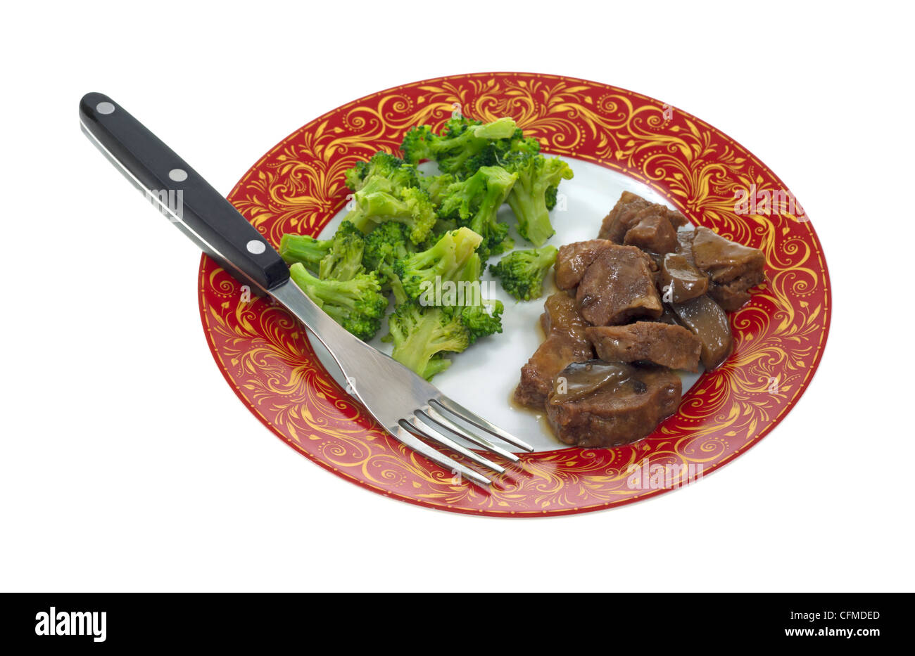 Beef tips and broccoli on plate with fork Stock Photo - Alamy