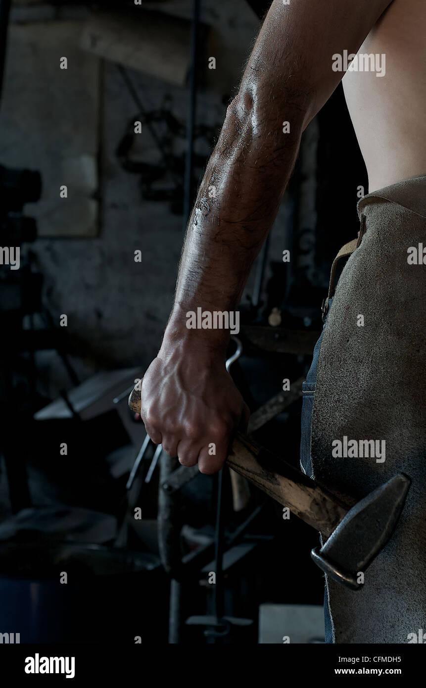 Sweating blacksmith during work Stock Photo - Alamy