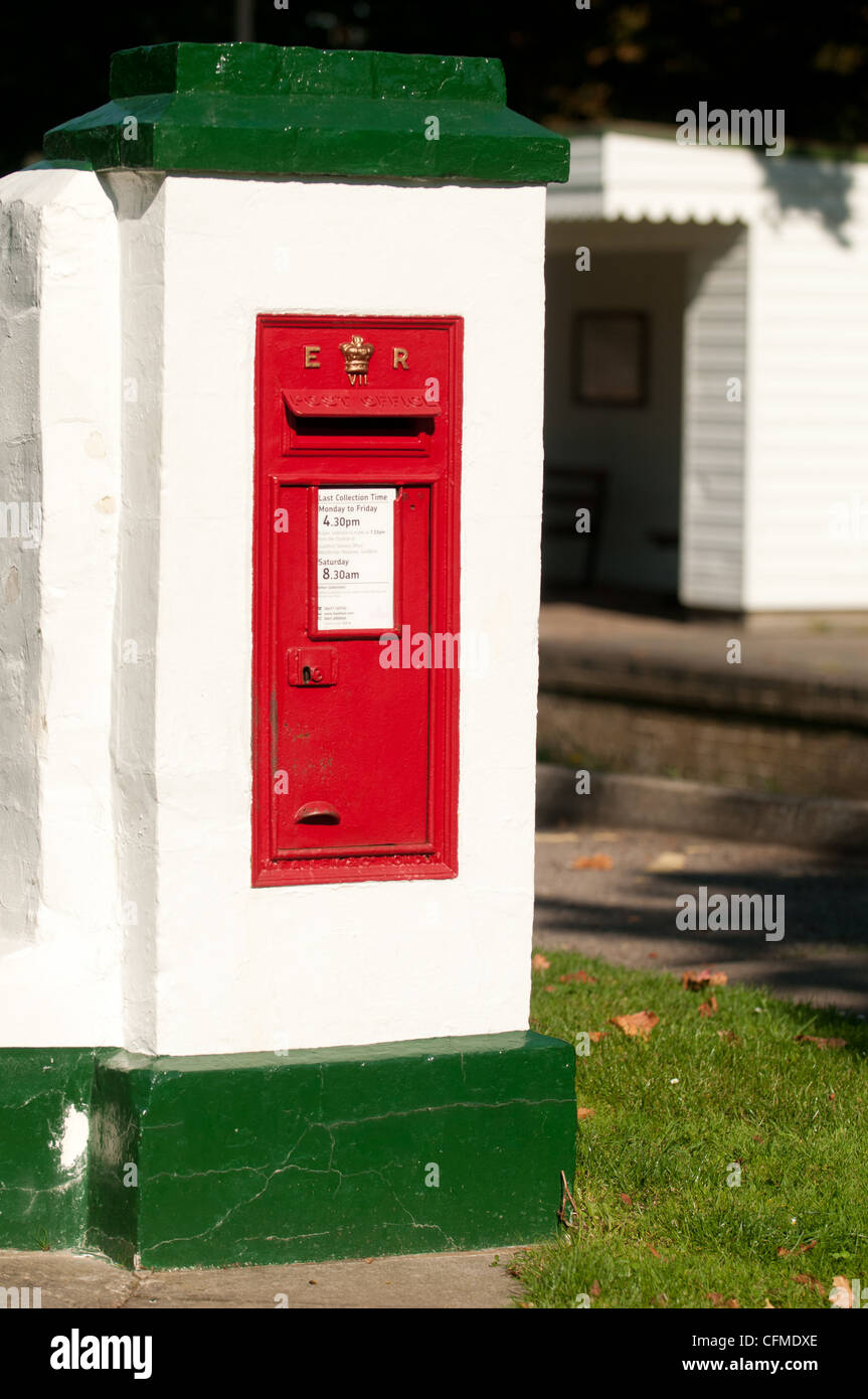 Bright red post boxes are a feature of the British towns and villages ...