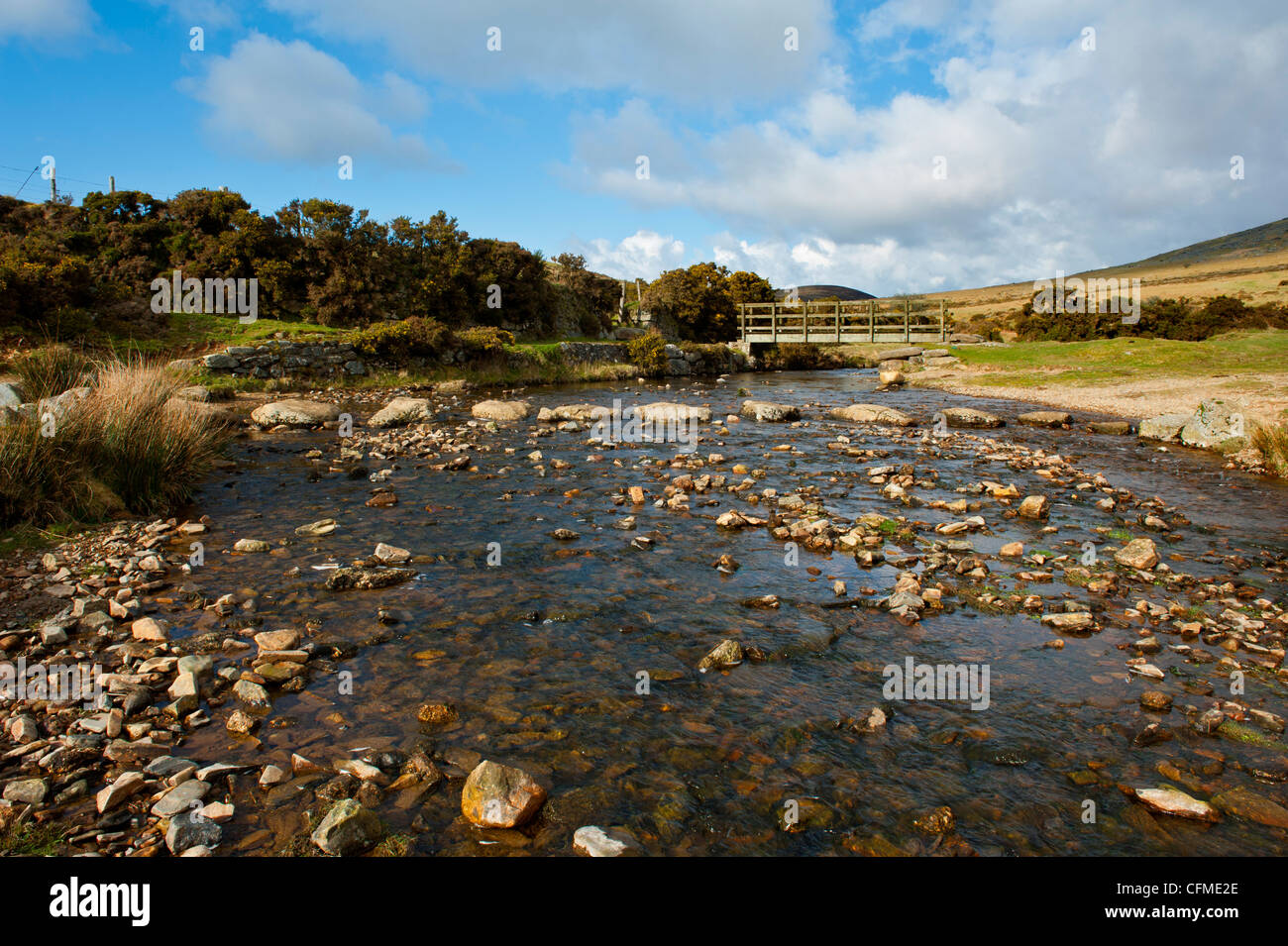 River Lyd with stepping stones and footbridge leading to Great Nodden ...