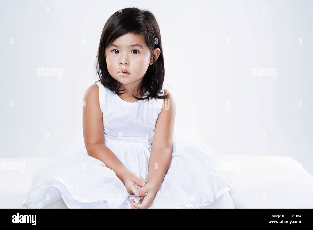 Studio portrait of little girl Stock Photo - Alamy