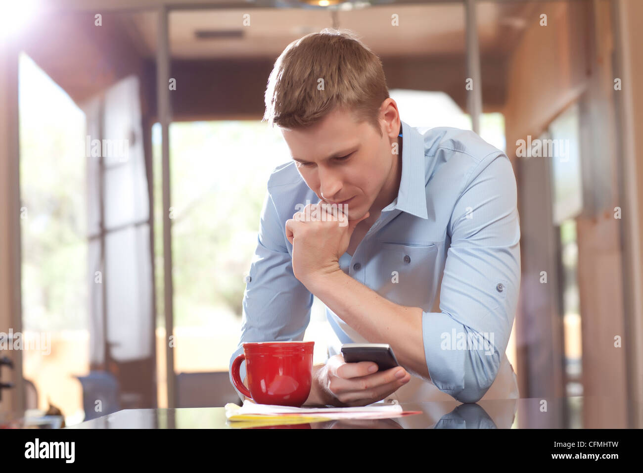 USA, Arizona, Phoenix, Man texting at home Stock Photo - Alamy