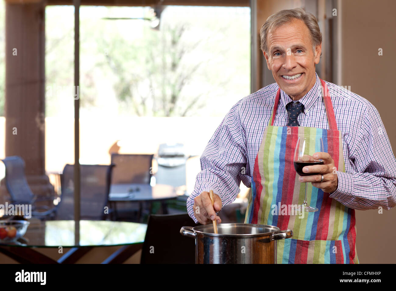 USA, Arizona, Phoenix, Portrait of man cooking and drinking wine Stock ...