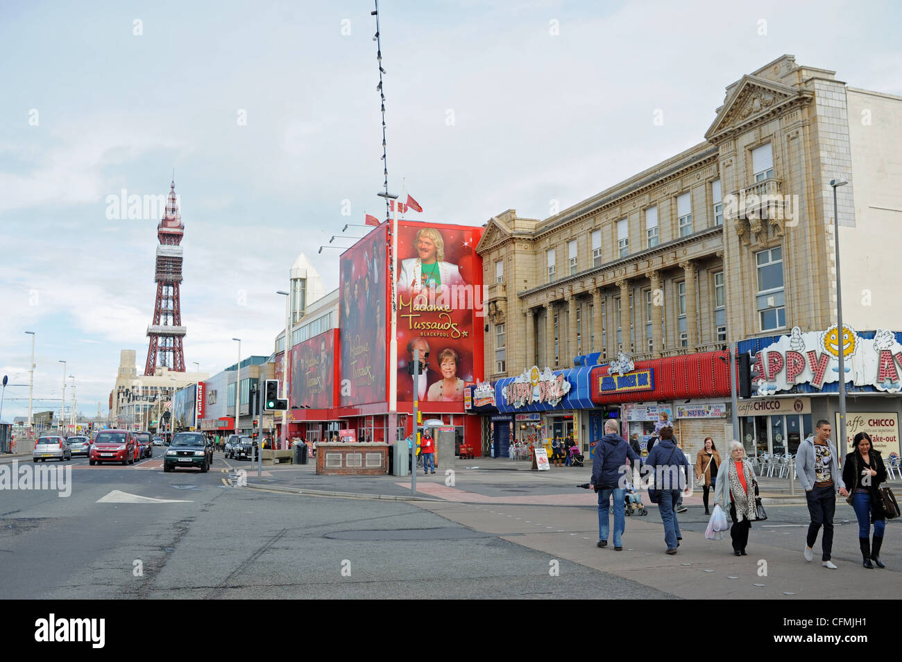 People walking on Blackpool seafront with the tower and Madame Tussauds ...