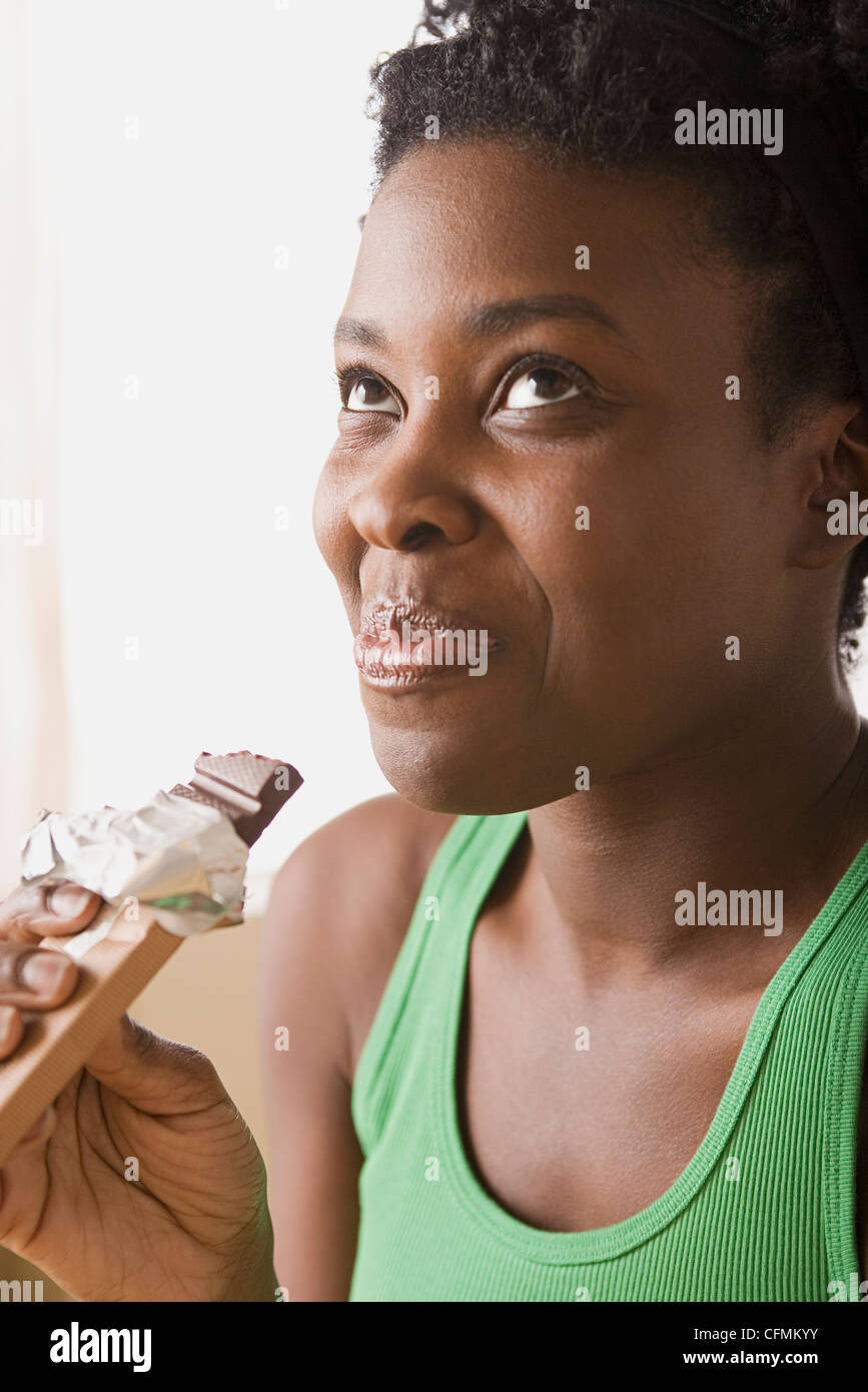 USA, California, Los Angeles, Woman eating chocolate bar Stock Photo ...