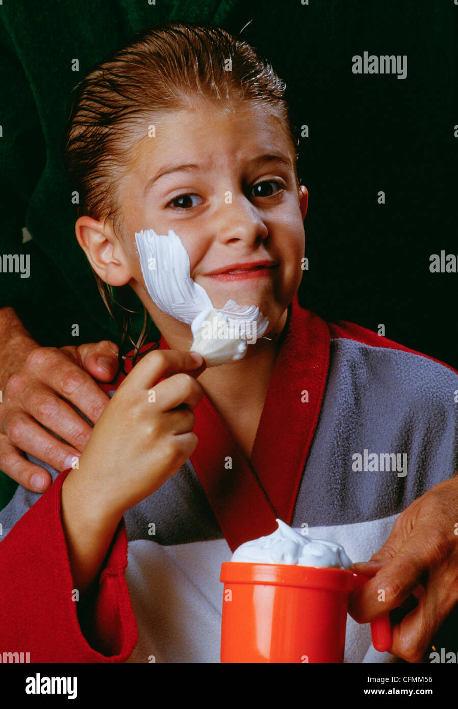 Young boy and father practicing first shave Stock Photo - Alamy