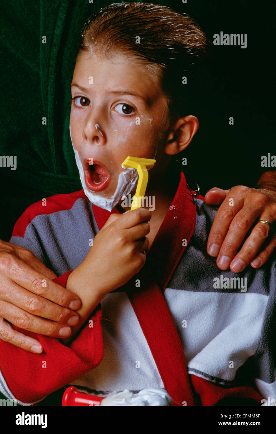 Young boy and father practicing first shave Stock Photo - Alamy