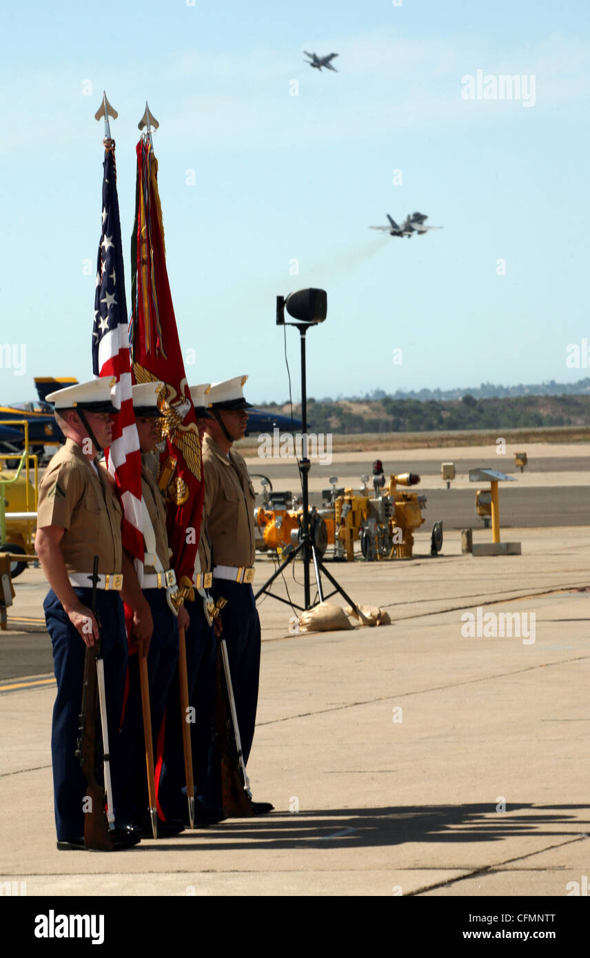 A Marine color guard stands at attention as F/A-18 Super Hornets lift ...