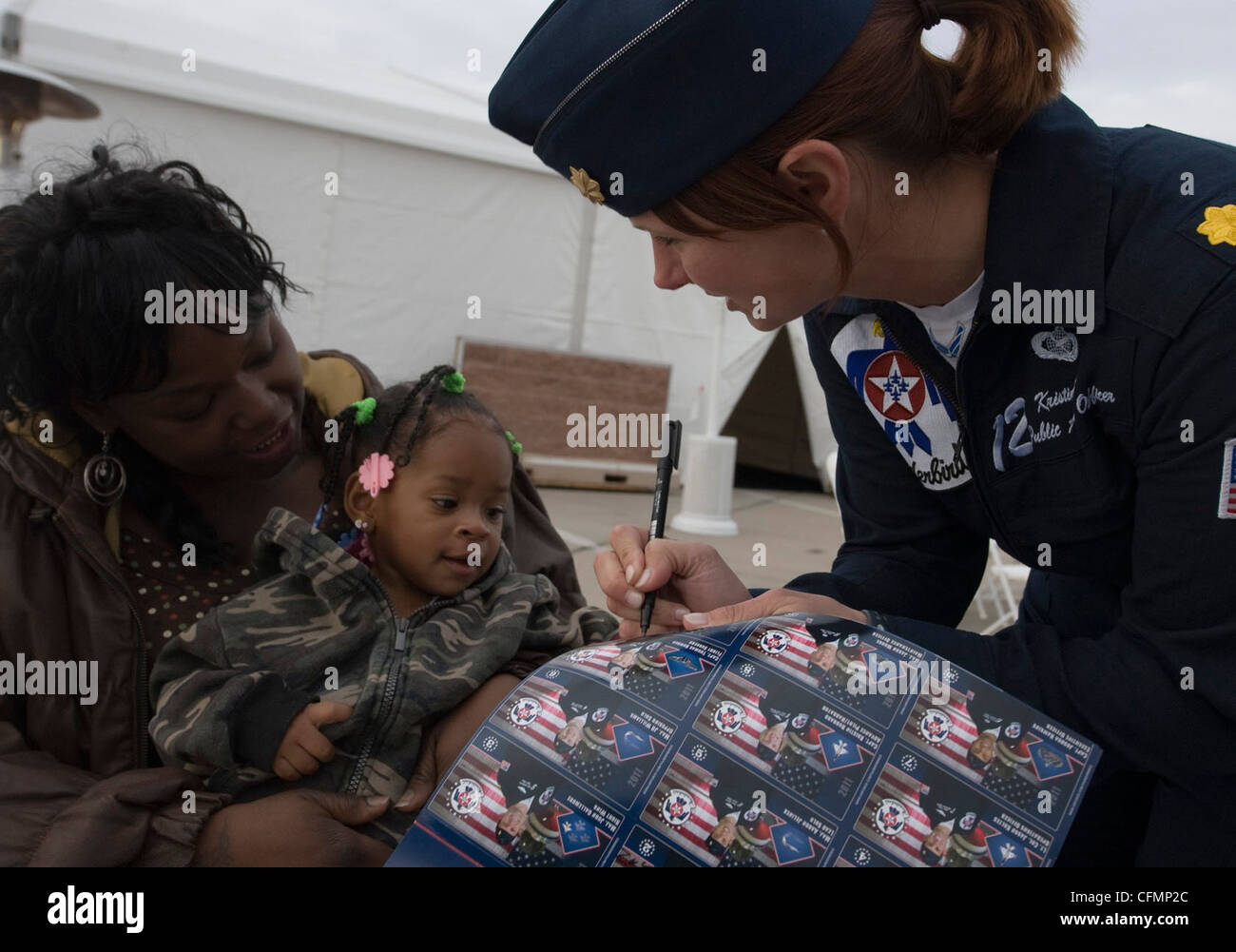 Tianna Morgan holds her niece Shannice Searles while Maj. Kristin Haley ...