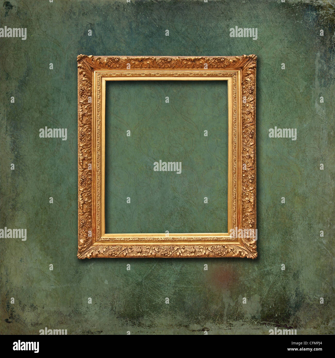 Vintage mockup, empty golden frame on a scratched grunge wallpaper with ...
