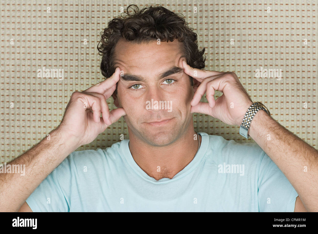 Portrait of man pulling face Stock Photo - Alamy