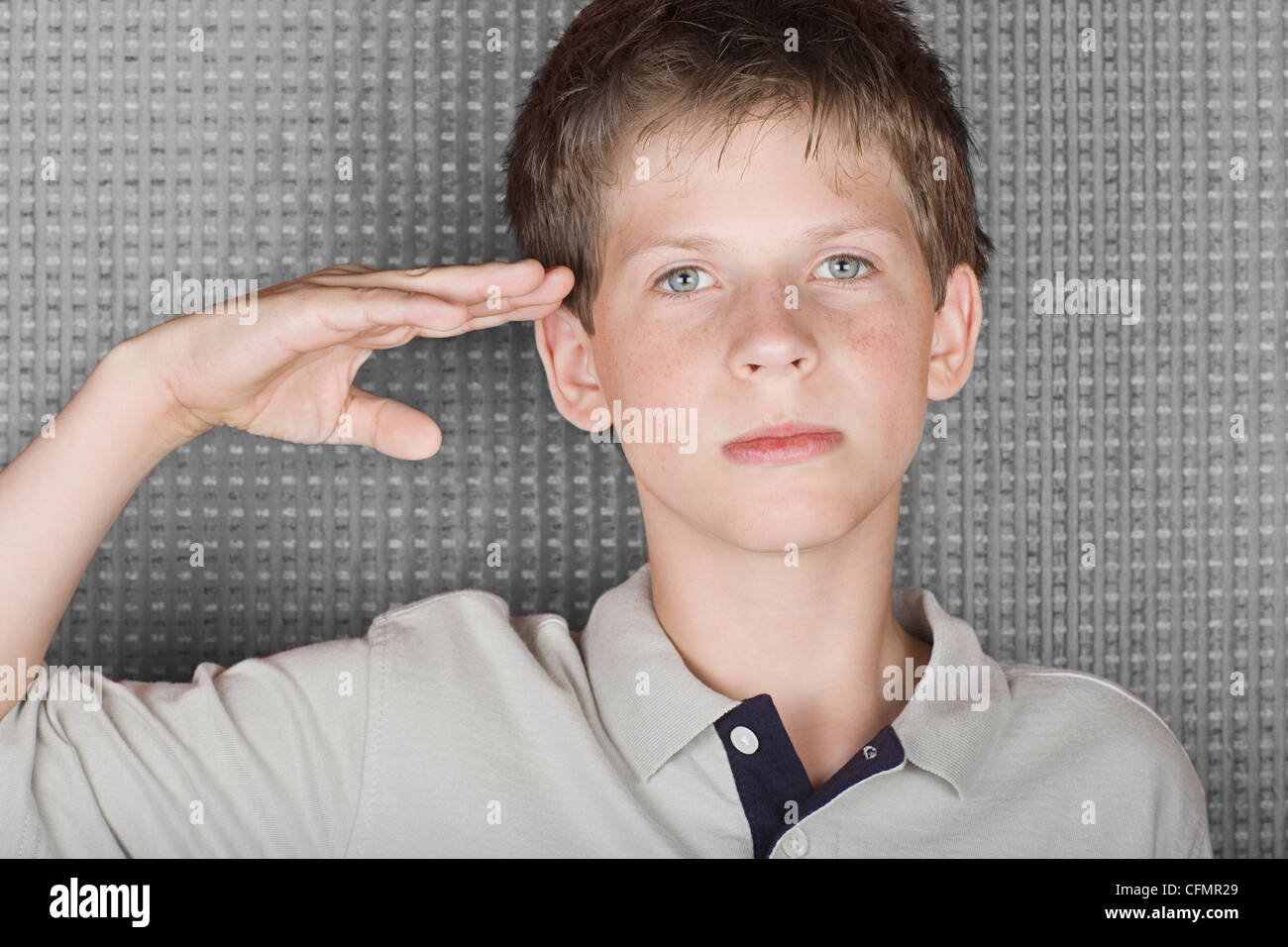 Portrait of saluting boy Stock Photo - Alamy