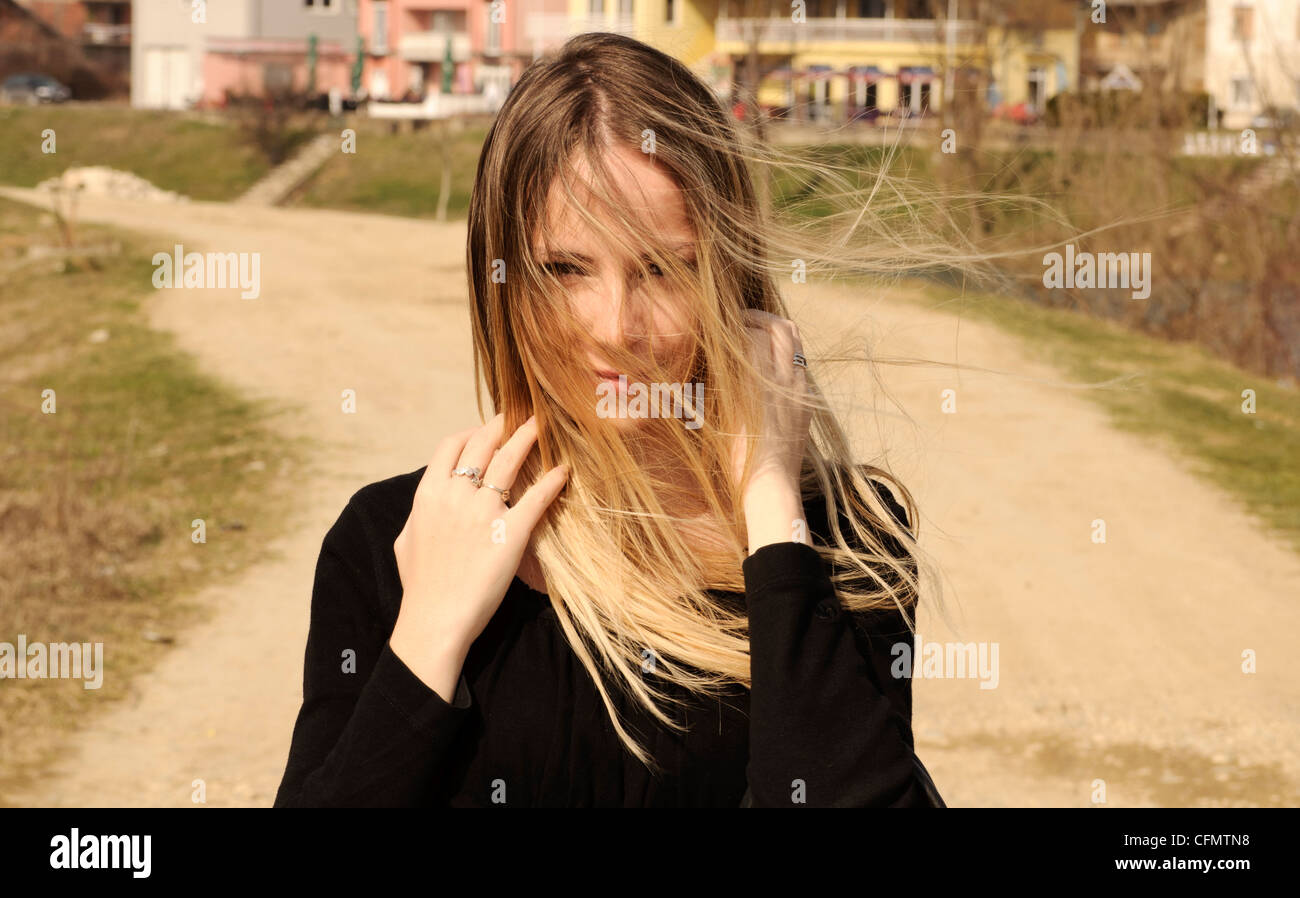 Strong wind blowing woman hi-res stock photography and images - Alamy