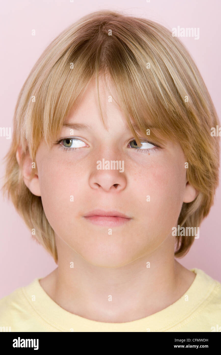 Studio shot portrait of teenage boy looking away, close-up Stock Photo ...
